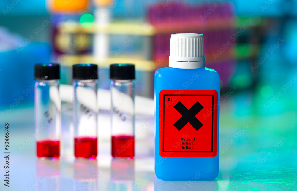 Dangerous substance in a plastic container on laboratory table Stock ...