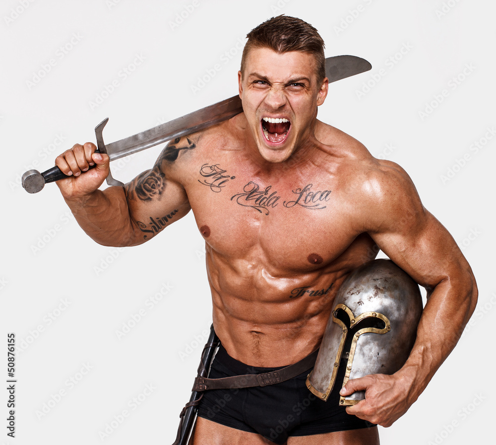 Huge shirtless warrior is screaming and holding his weapon Stock Photo ...