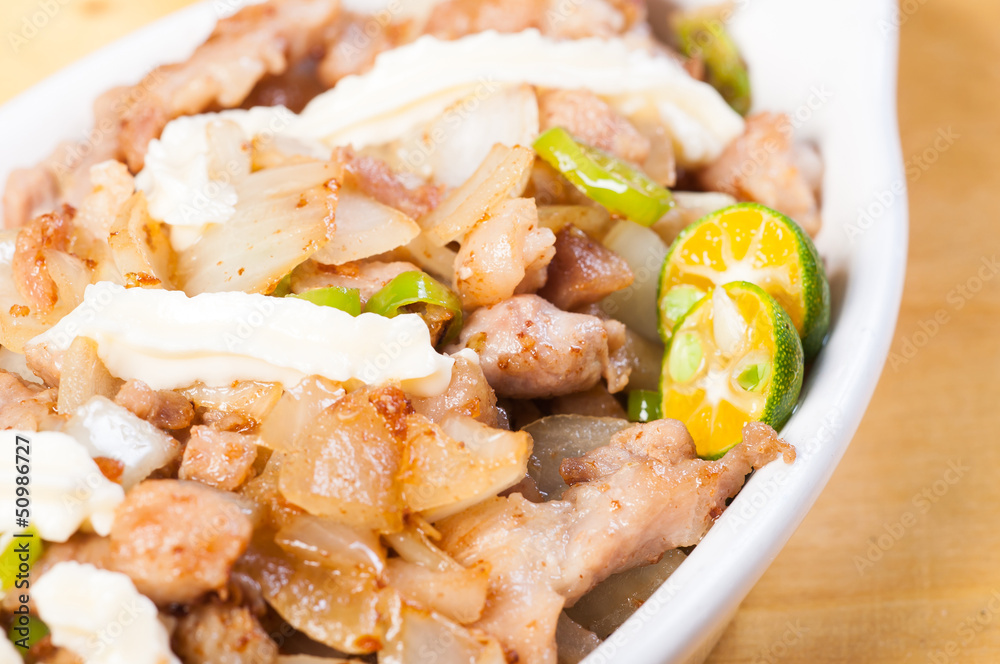 pork sisig a popular delicacy in the philippines Stock Photo | Adobe Stock