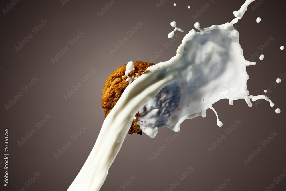 Chocolate Chip Cookie with a Splash of milk. Stock Photo | Adobe Stock