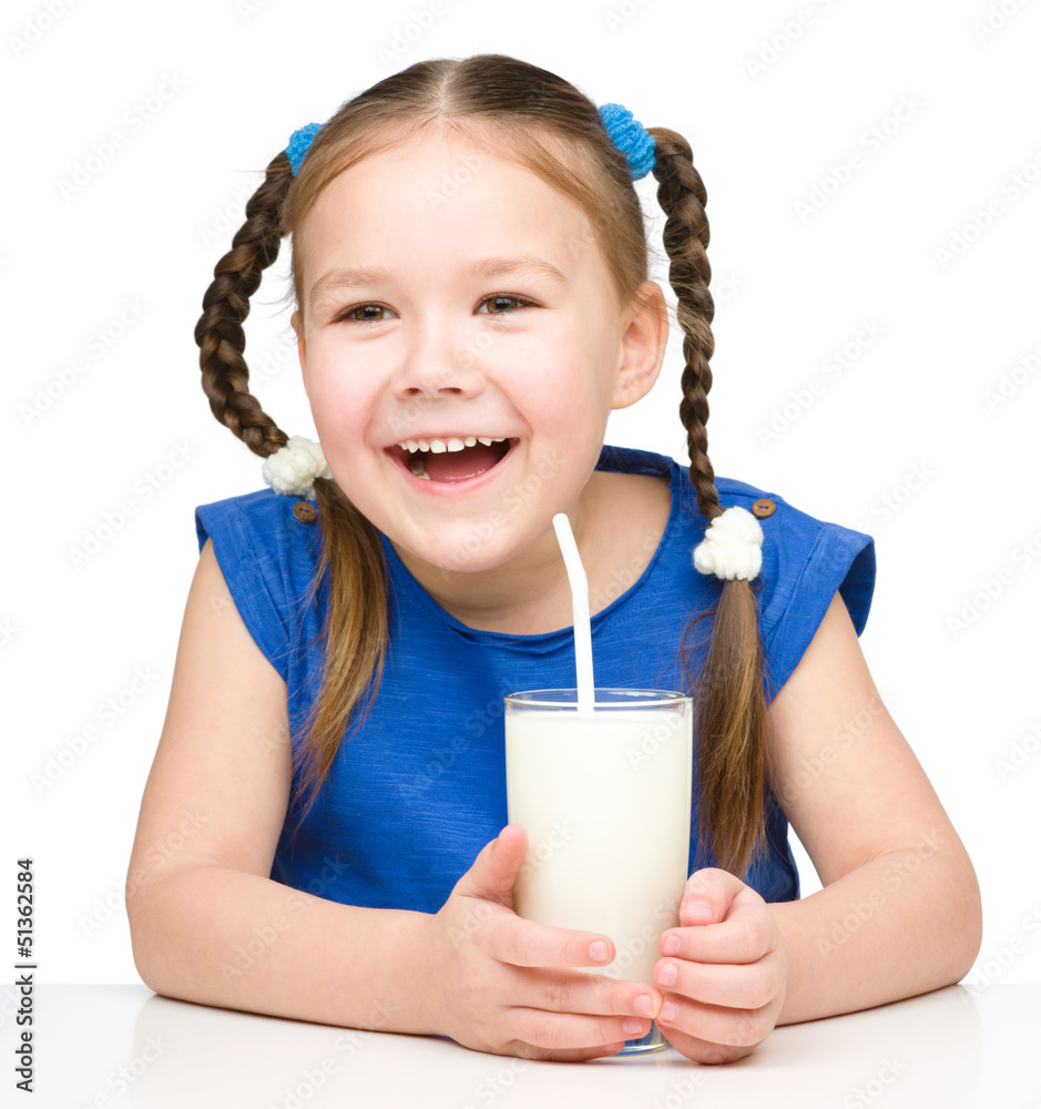 Cute little girl with a glass of milk Stock Photo | Adobe Stock