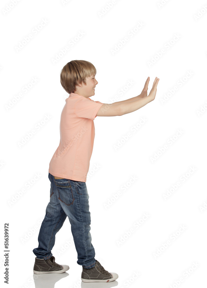 Boy pushing something Stock Photo | Adobe Stock