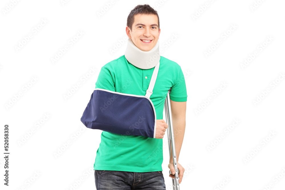 Full length portrait of a smiling male with broken arm and crutc Stock ...