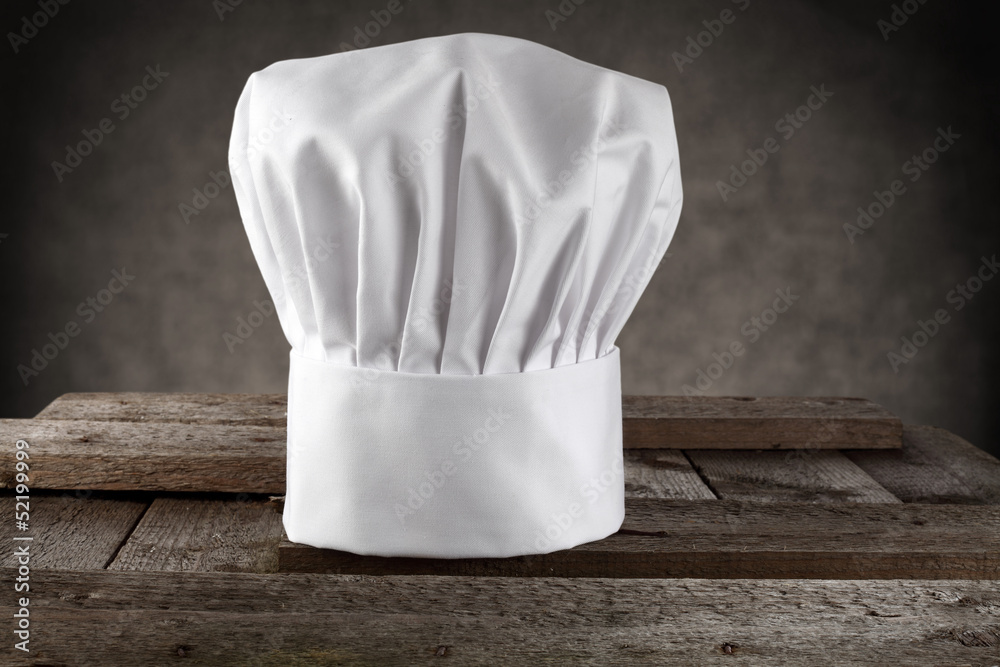 chef hat onplank table Stock Photo | Adobe Stock