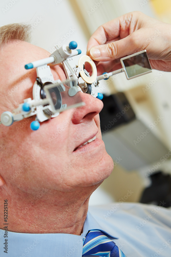 Man with trial frame at optician Stock Photo | Adobe Stock