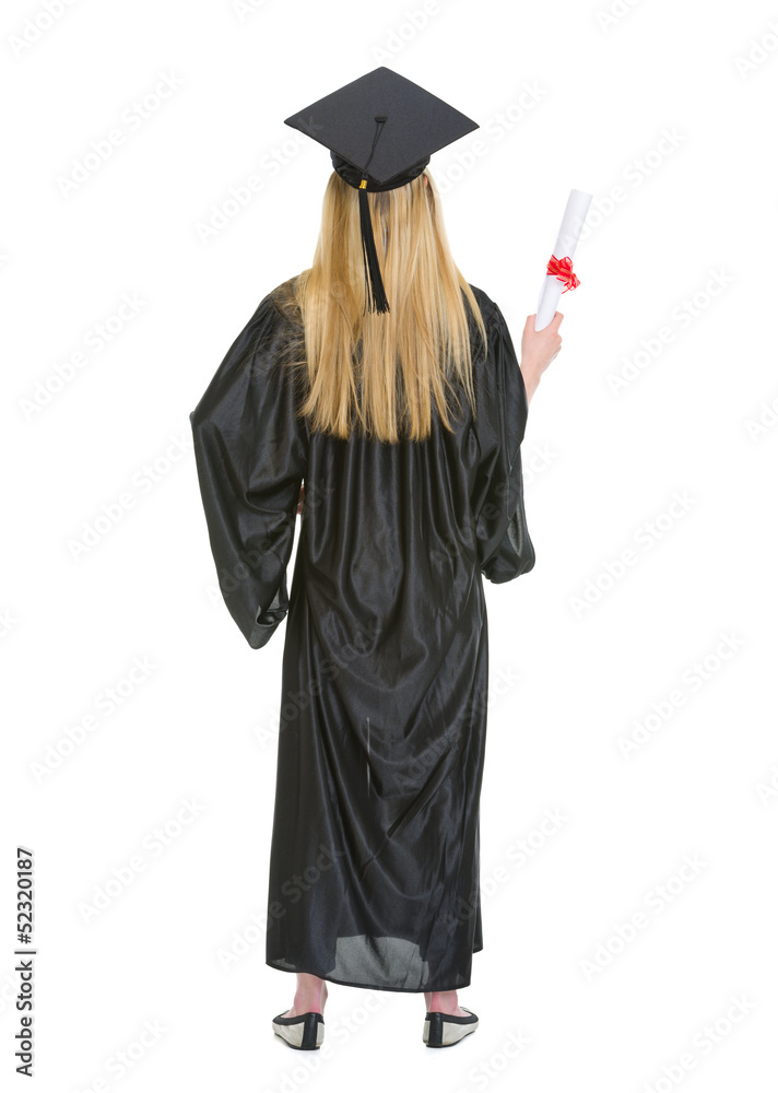 Full length portrait of woman in graduation gown showing diploma Stock ...