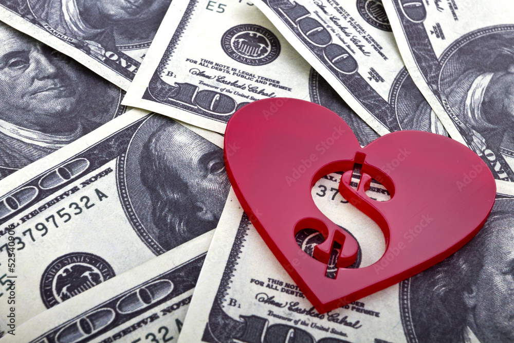 Red heart shape with a dollar sign Stock Photo | Adobe Stock
