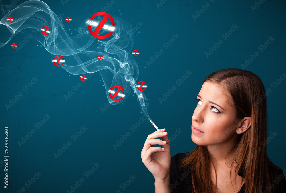 Young woman smoking dangerous cigarette with no smoking signs Stock ...