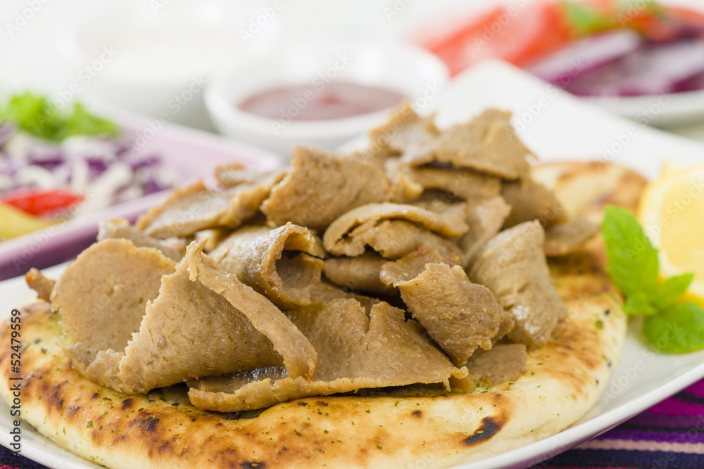 Donner Meat on Naan - Slices of donner meat on a flatbread Stock Photo ...