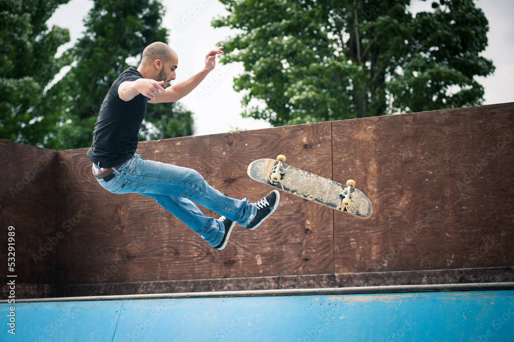 Skateboarder falling from halfpipe at skatepark. Stock Photo | Adobe Stock