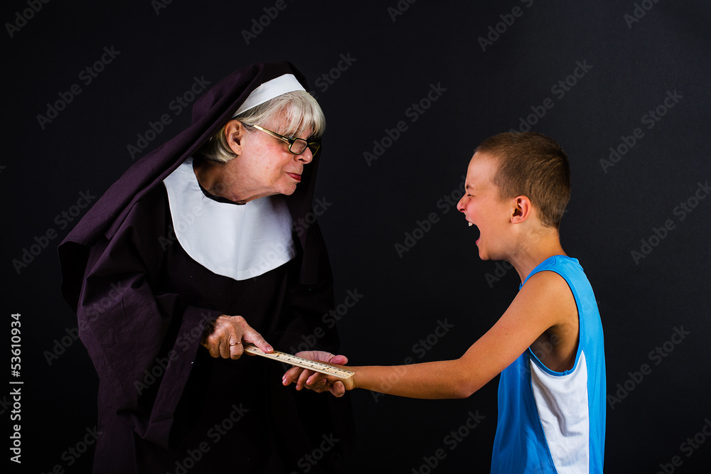 Young boy crying after being hit on knuckles by a nun Stock Photo ...