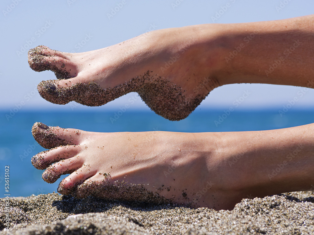 sandy crazy woman toes on the beach Stock Photo | Adobe Stock