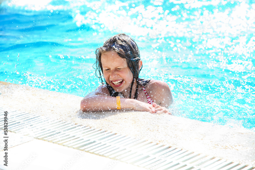 Smiling cute little girl having fun in swimming pool. Stock Photo ...