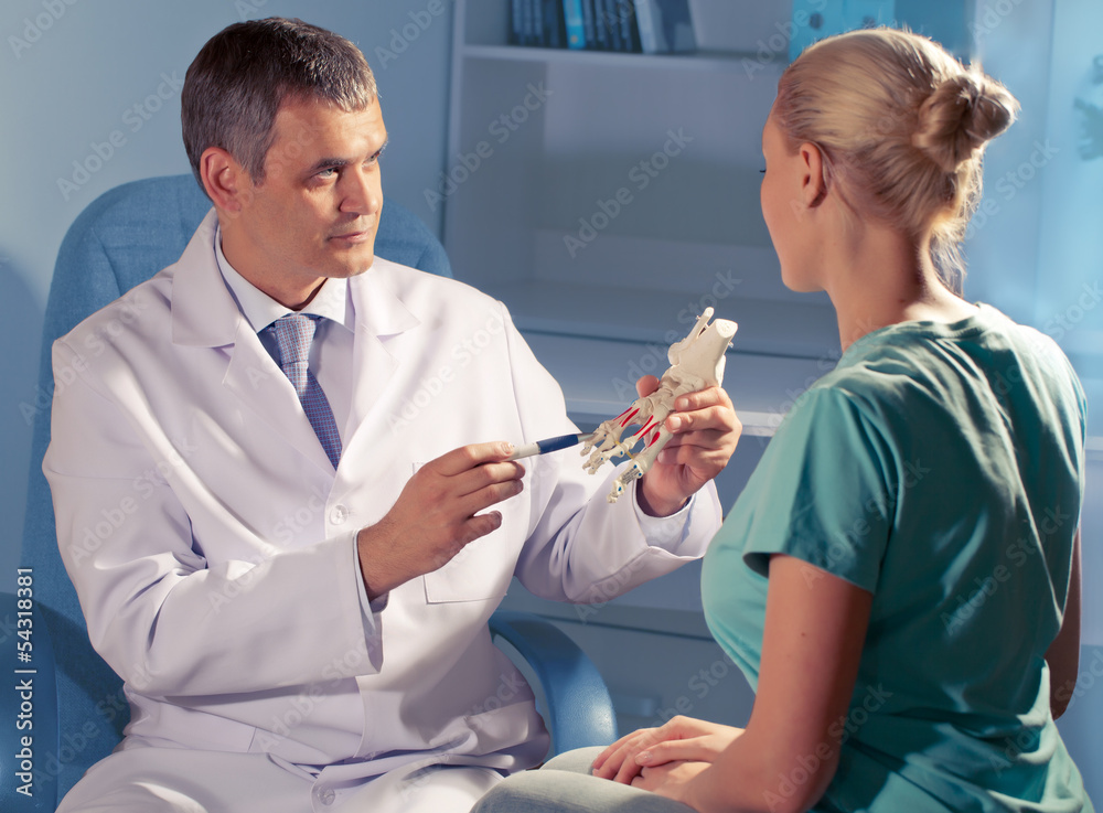 orthopedic doctor in his office with the model of foot Stock Photo ...
