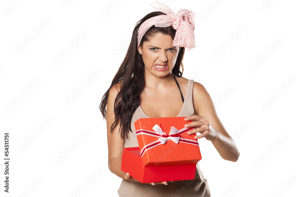 pretty girl is not happy and is disgusted her gift Stock Photo | Adobe ...