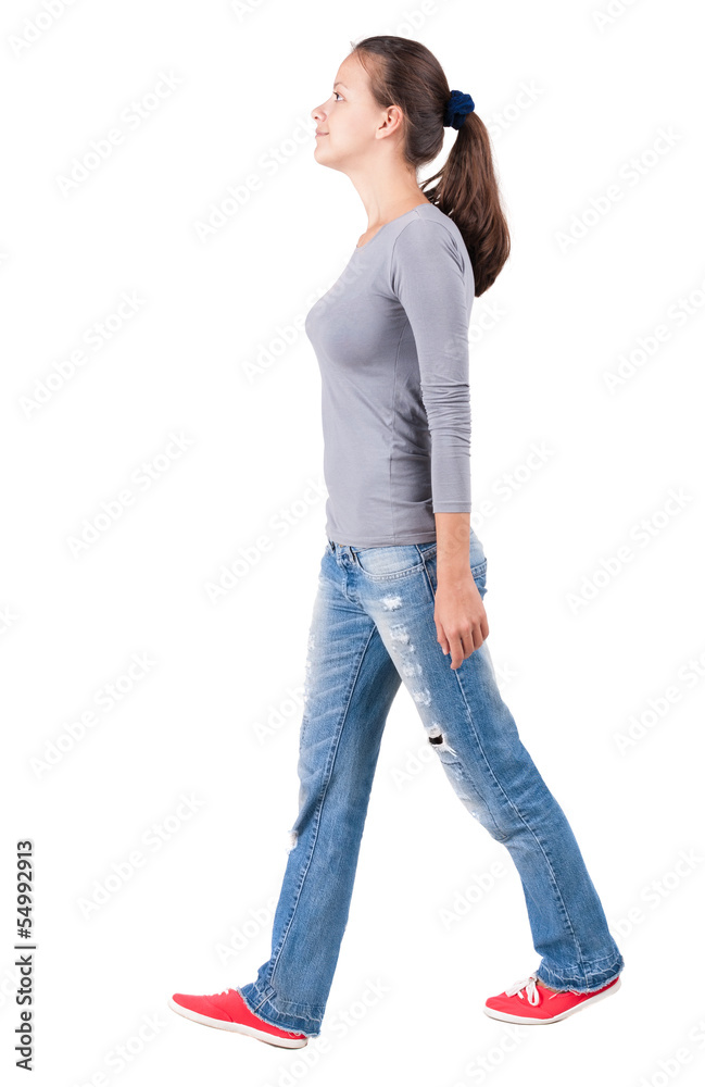 back view of walking woman. Stock Photo | Adobe Stock