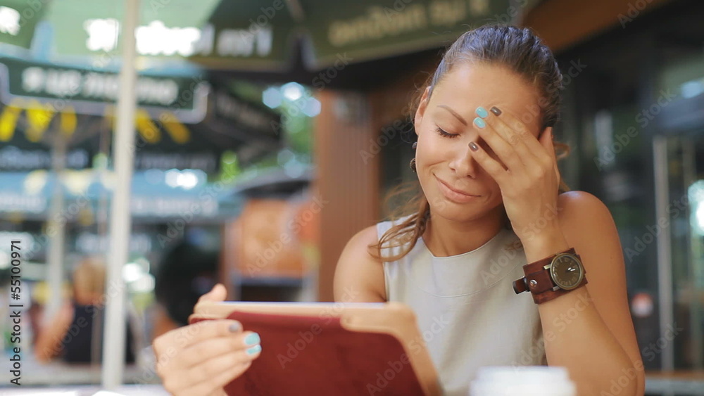 woman sitting in a cafe, she looks very sad Stock Video | Adobe Stock
