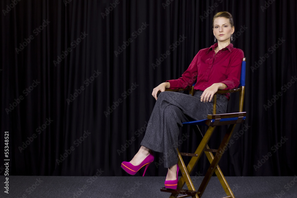 woman speaking on stage with black curtain background Stock Photo ...