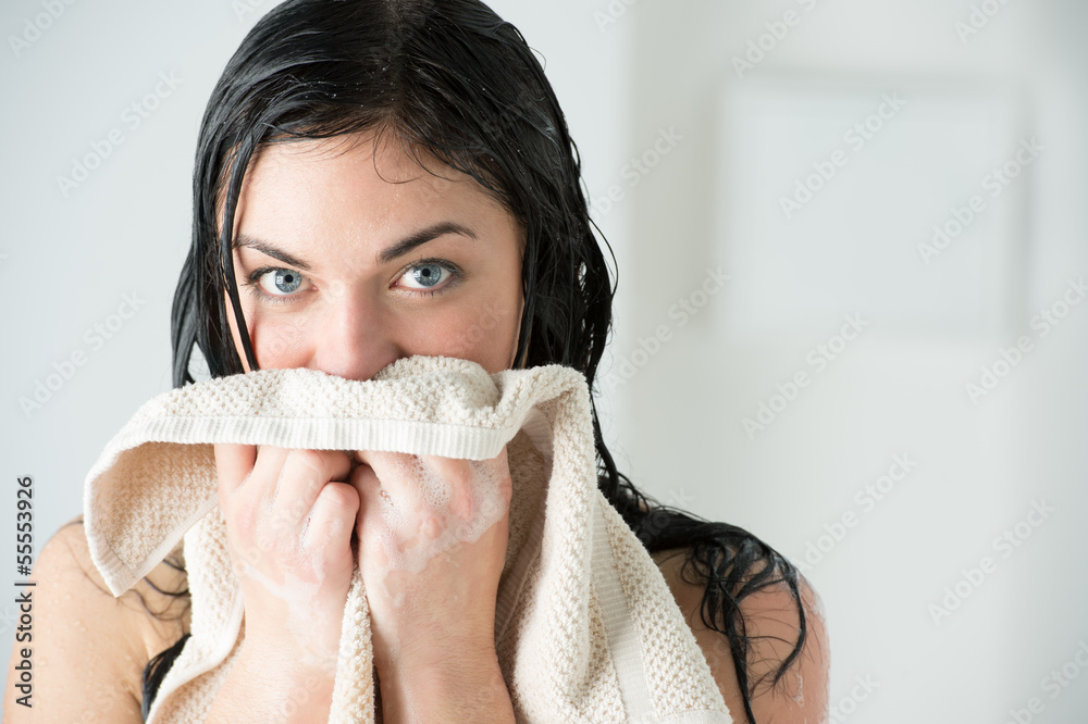 Sexy woman wiping herself with towel after taking shower Stock Photo ...