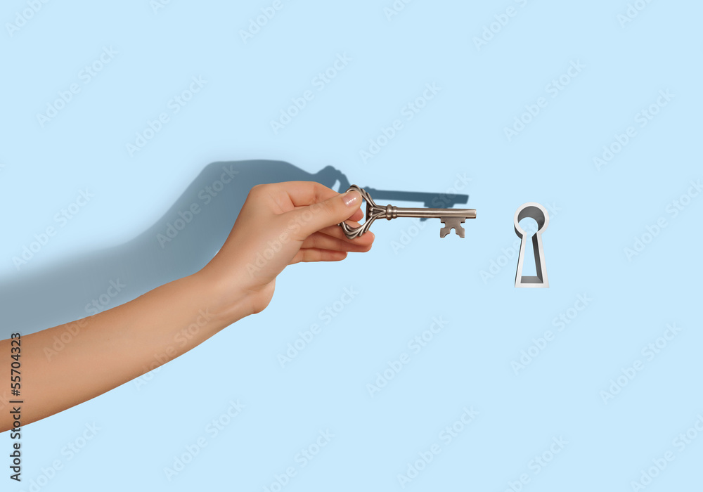 Hand with key Stock Photo | Adobe Stock