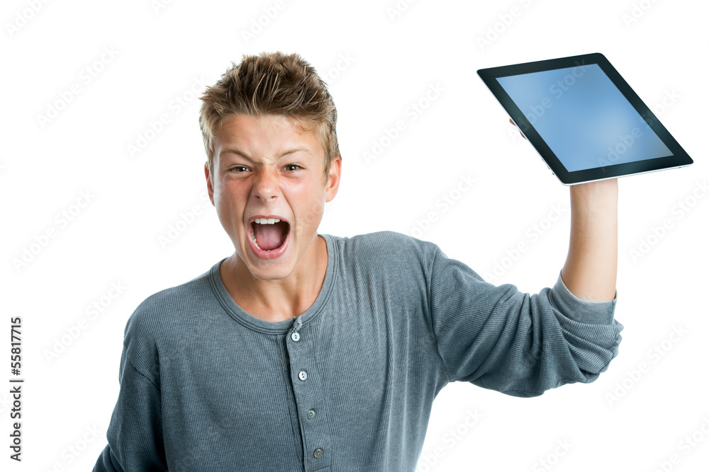 Angry teen about to smash tablet. Stock Photo | Adobe Stock