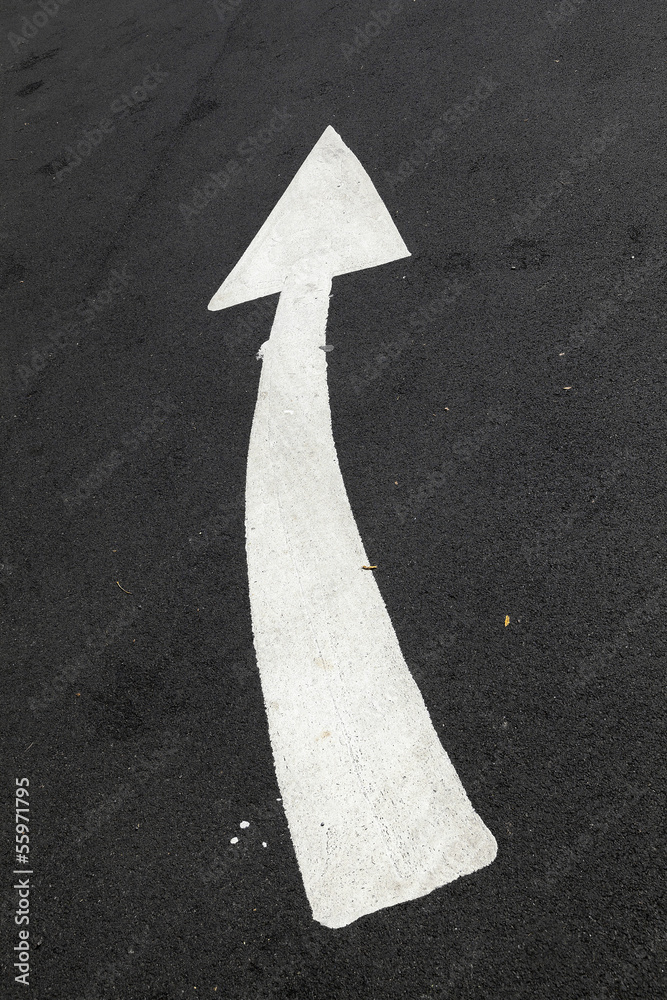 Curved White Arrow on a Black Tarmac Road. Stock Photo | Adobe Stock