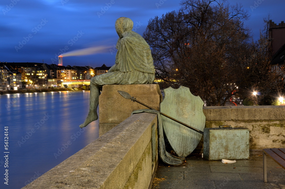 Sitting Helvetia statue on the river Rhine in Basel, Switzerland Stock ...