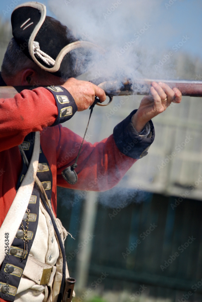 Historic British Soldier Firing a Musket Stock Photo | Adobe Stock