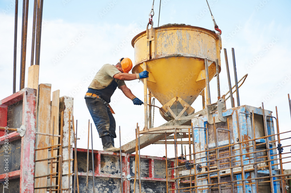 building workers pouring concrete with barrel Stock Photo | Adobe Stock