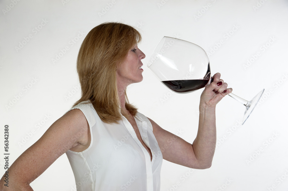 Woman drinking from a very large glass of red wine Stock Photo | Adobe ...