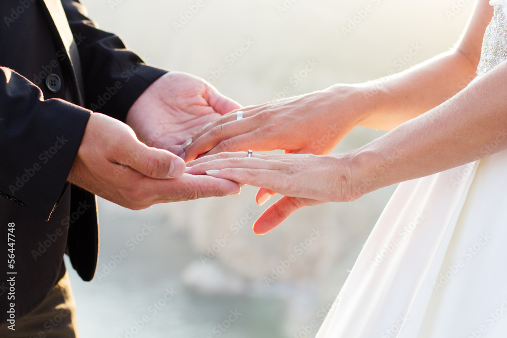 Wedding couple holding hands on sunset background Stock Photo | Adobe Stock