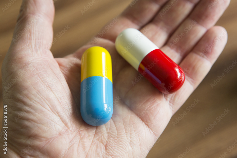 Hand Holding Oversized Medication Capsules Stock Photo | Adobe Stock