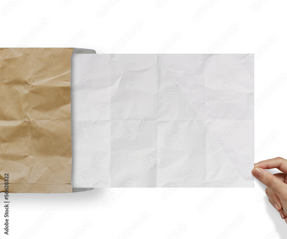 hand pulling crumpled paper from recycle envelope Stock Photo | Adobe Stock