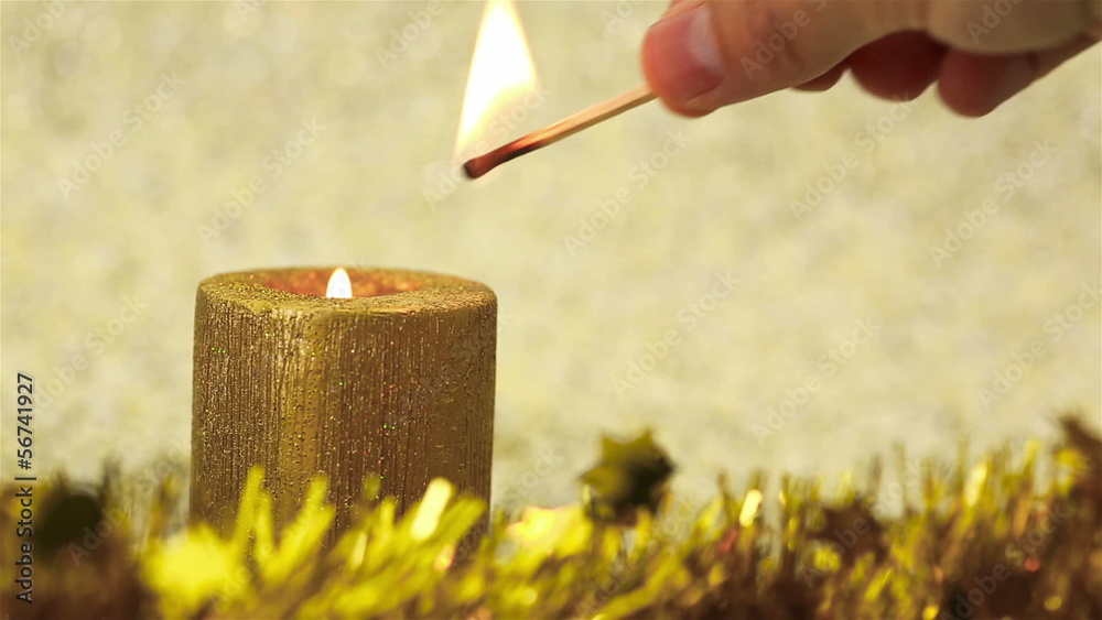 Lighting a christmas candle with match Stock Video | Adobe Stock