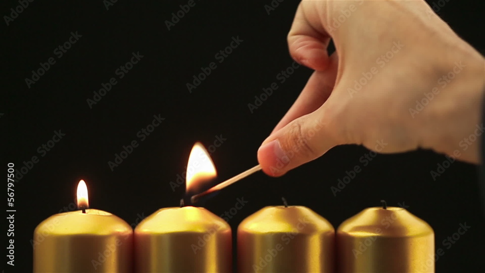 Christmas candles getting lit and blown out Stock Video | Adobe Stock