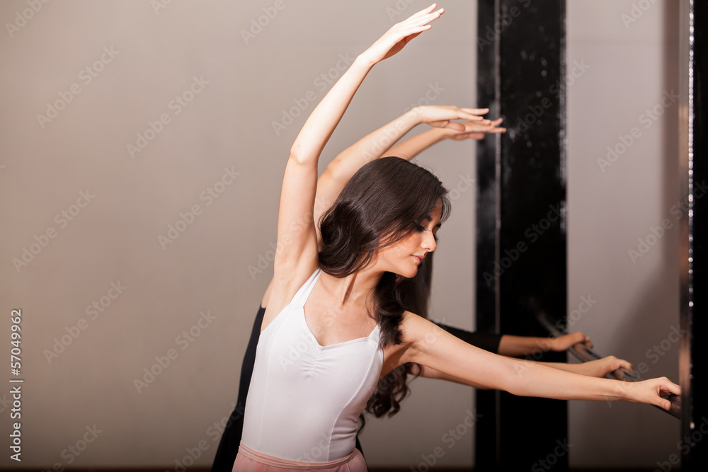 Practicing in a ballet barre Stock Photo | Adobe Stock