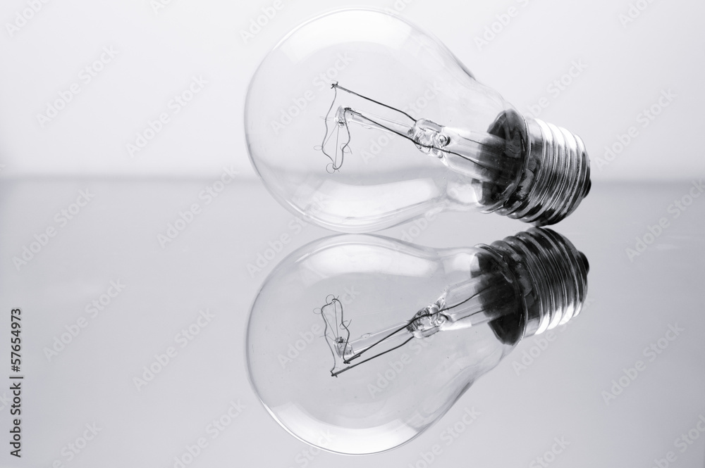 Light bulb and its reflection Stock Photo | Adobe Stock