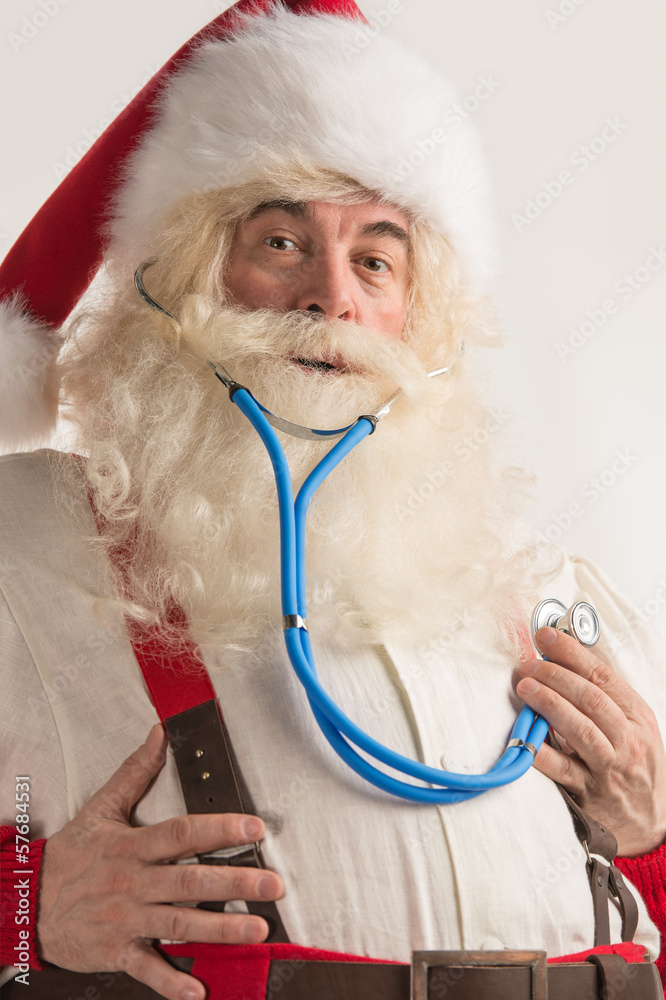 Santa Claus Doctor using a stethoscope on himself Stock Photo | Adobe Stock