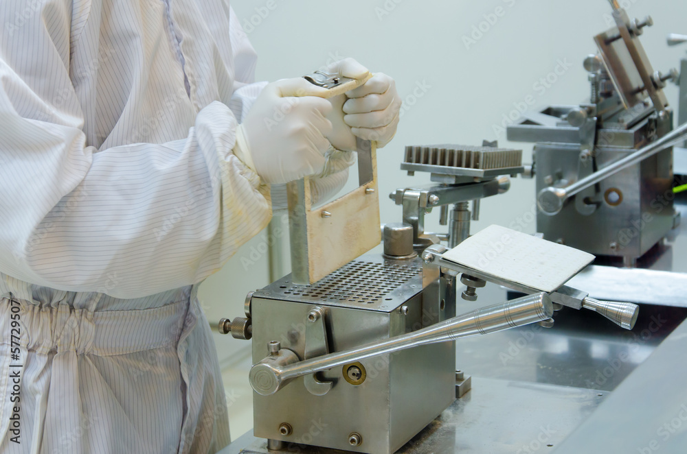 pharmacist preparing medication with packaging capsule Stock Photo ...