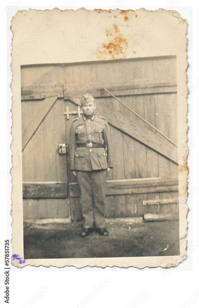 German soldier in front of wooden gate - circa 1945 Stock Photo | Adobe ...