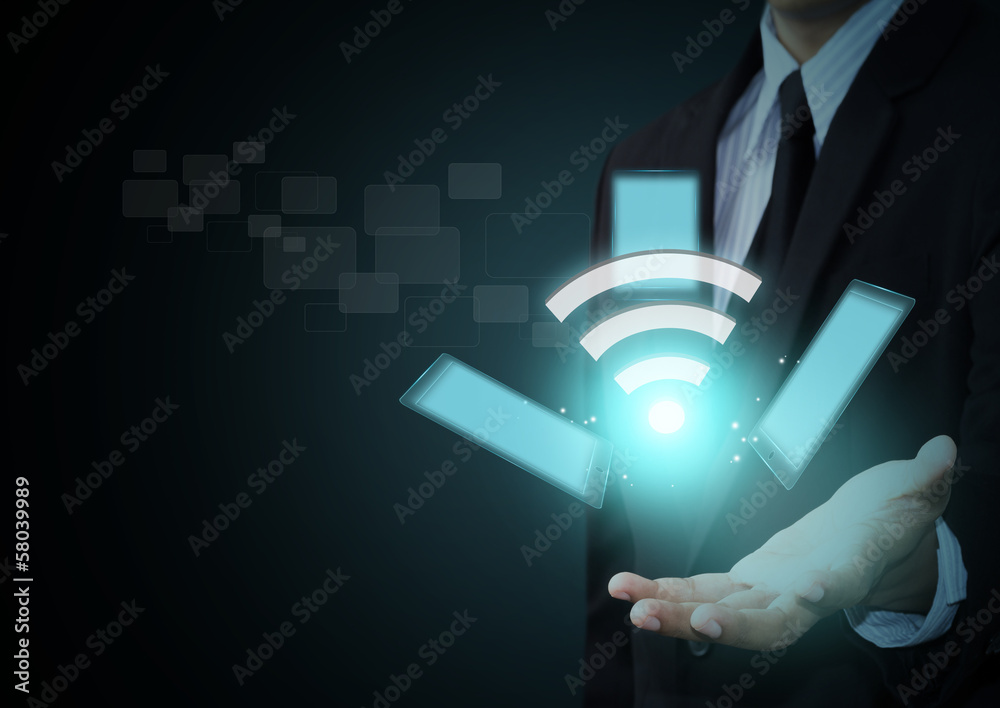 Wifi symbol and touch pad technology on businessman hand Stock Photo ...