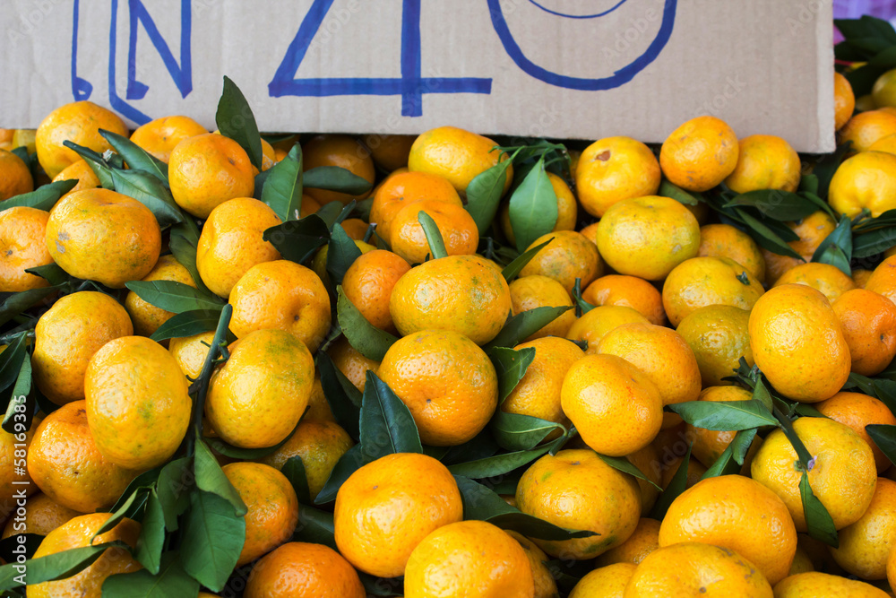 Bunch of fresh mandarin oranges on market Stock Photo | Adobe Stock