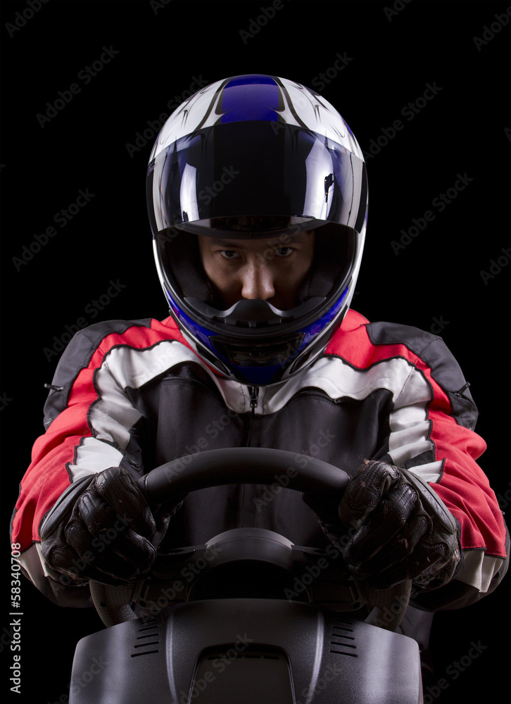 racerwearing red racing suit and blue helmet on a steering wheel Stock ...