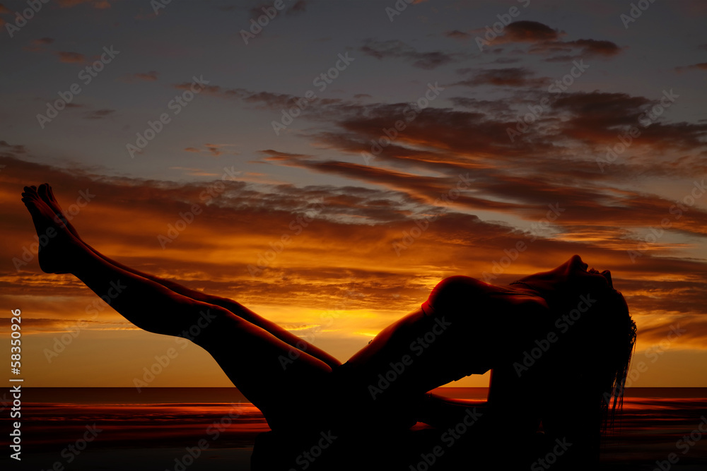 Silhouette woman lay back barefeet lifted up Stock Photo | Adobe Stock
