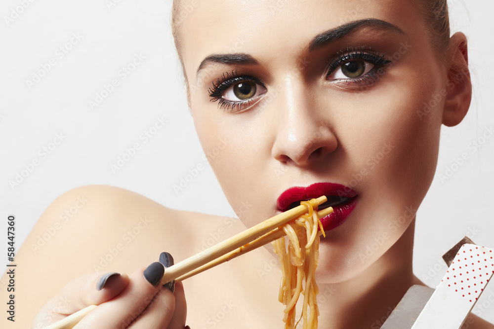 Beautiful woman eating chinese food. wok. noodles Stock Photo | Adobe Stock