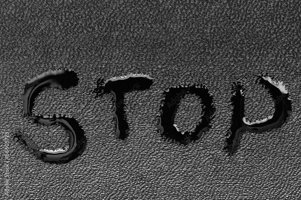 The word "STOP" on a black background Stock Photo | Adobe Stock