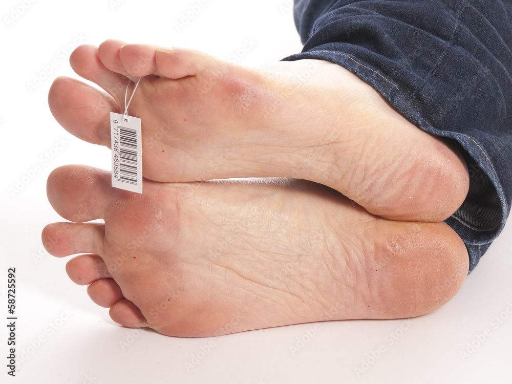 dead feet with barcode in a morgue Stock Photo | Adobe Stock