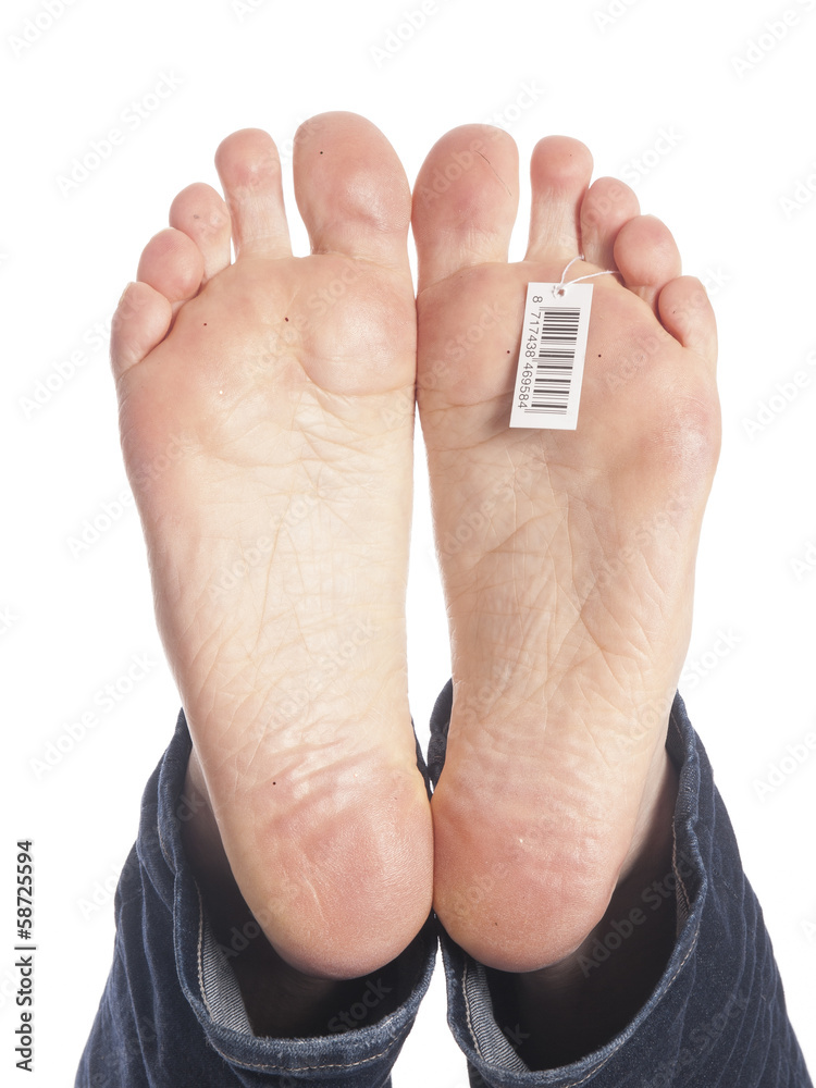 dead feet with barcode in a morgue Stock Photo | Adobe Stock