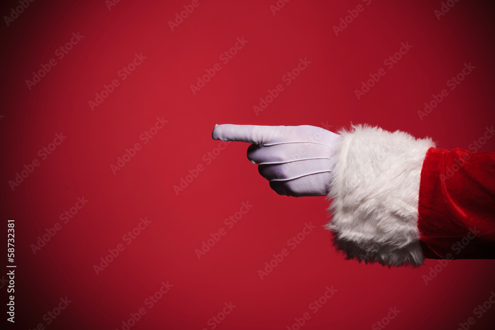 Santa Claus gloved hand pointing finger Stock Photo | Adobe Stock
