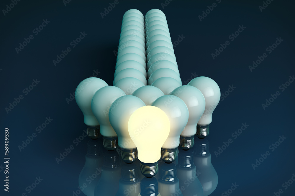 Leadership concept. One glowing light bulb standing in front of Stock ...
